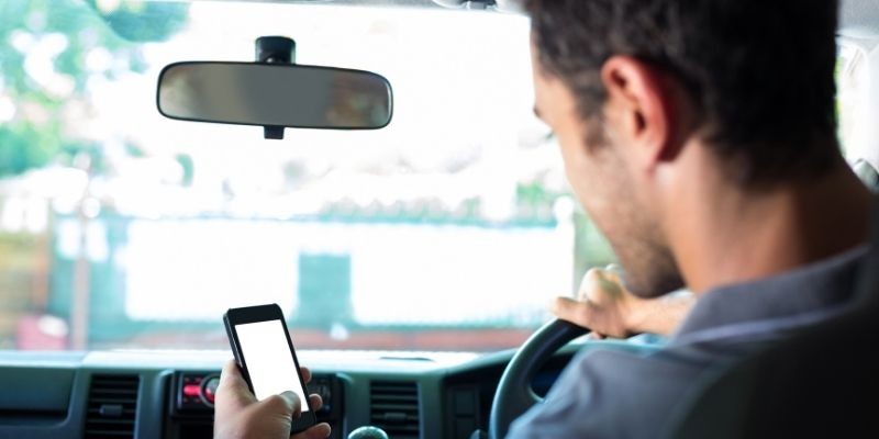 Smartphones in cars the uk law on using phones and sat navs when ...